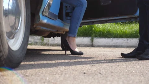 Legs of girl getting out of auto. Man op... | Stock Video | Pond5