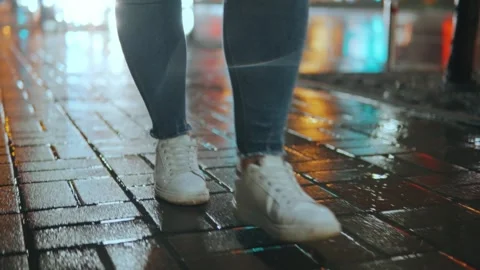 Legs of a girl taking a step into a pudd... | Stock Video | Pond5