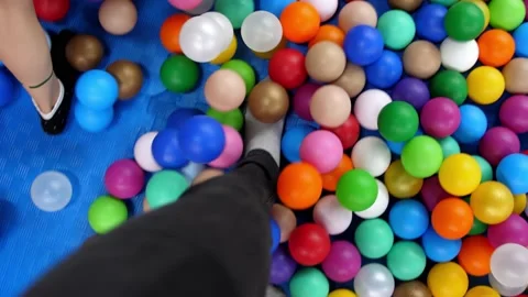 Legs in jeans and socks walk among many ... | Stock Video | Pond5