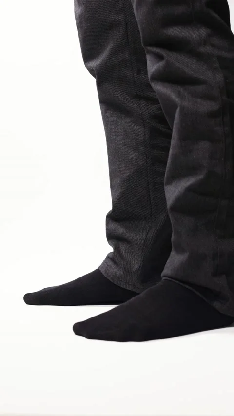 Legs of a man demonstrating black socks ... | Stock Video | Pond5