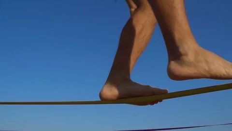 Legs of Man Walking on The Rope at the E... | Stock Video | Pond5