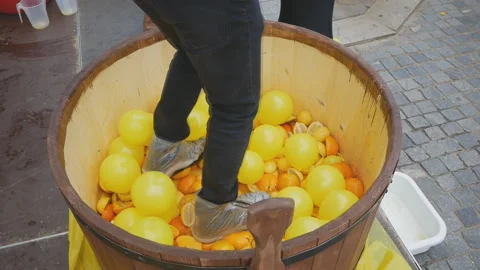 legs stomping citrus fruits into a woode... | Stock Video | Pond5