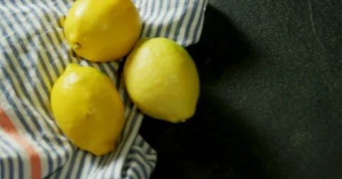 Lemon with a cloth on black background 4... | Stock Video | Pond5