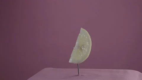 Lemon rotating with loop on fuchsia scre... | Stock Video | Pond5