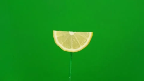 lemon slice spin on green screen | Stock Video | Pond5