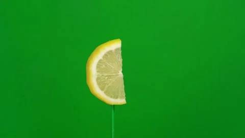 lemon slice spin on green screen | Stock Video | Pond5