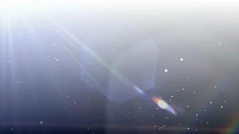 Lens flare and floating particles on bla... | Stock Video | Pond5