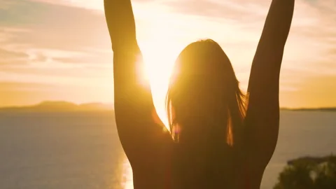 LENS FLARE, CLOSE UP: Pretty lady stretc... | Stock Video | Pond5