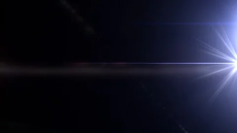 Lens flare light with subtle glow on bla... | Stock Video | Pond5