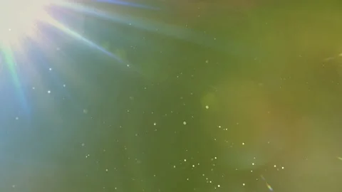 Lens flare smoke and floating particles... | Stock Video | Pond5