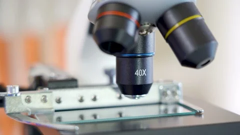 The lenses of the small microscope in th... | Stock Video | Pond5