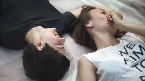 Lesbians laying on cover upside down to ... | Stock Video | Pond5