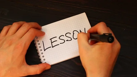 Lesson Hands write a word close-up | Stock Video | Pond5