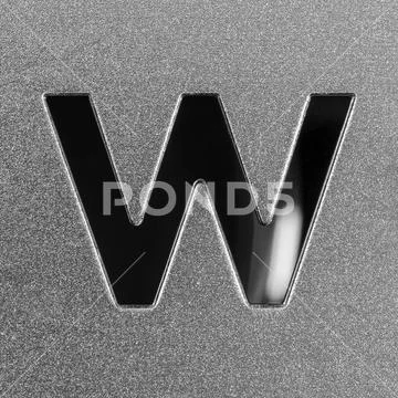 Letter W on a silver grained shiny metal surface. English alphabet ...