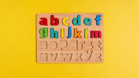 Letters of the English alphabet on a yel... | Stock Video | Pond5