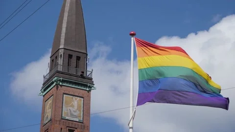 LGBT flag with city hall tower, slow mot... | Stock Video | Pond5