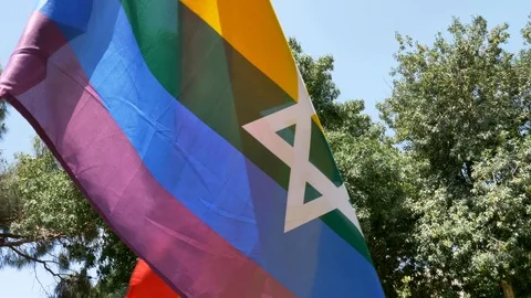 LGBT flag with the star of David, waving... | Stock Video | Pond5