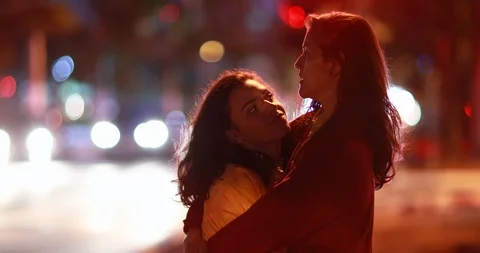 LGBT lesbian couple at night hugging and... | Stock Video | Pond5