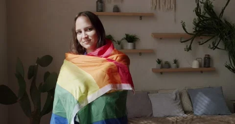 Lgbt women rest at home with pride rainb... | Stock Video | Pond5