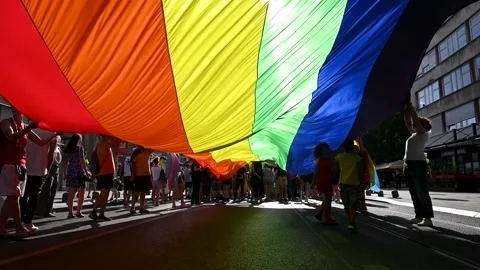 LGBTIQ flag on the street. A symbol of t... | Stock Video | Pond5