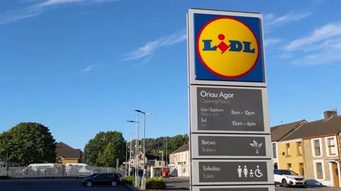 Lidl Sign Showing Opening Times UK 4K | Stock Video | Pond5