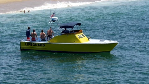 Lifeguard boat on patrol in the water ne... | Stock Video | Pond5