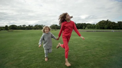 Lifestyle brother and sister running in ... | Stock Video | Pond5