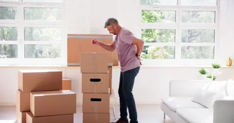 Lifting Heavy Box With Back Pain | Stock Video | Pond5