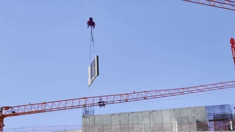 Lifting a load of formwork for pouring c... | Stock Video | Pond5
