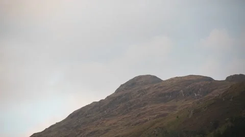 Light and cloud moving over Scottish mou... | Stock Video | Pond5