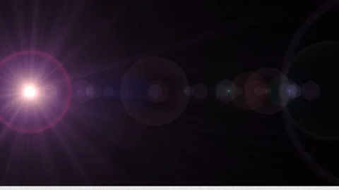 Light beam with lens flares on a black b... | Stock Video | Pond5