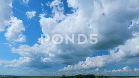 Photograph: Light Cloudiness On A Sky Background. White Fluffy Clouds ...