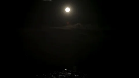 The light of the full moon is reflected ... | Stock Video | Pond5