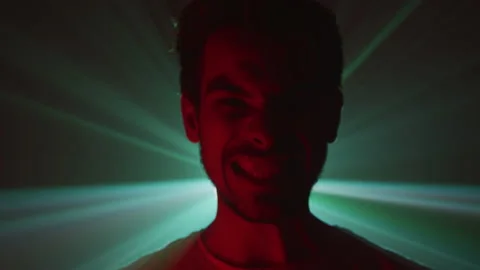 Light rays projected behind a screaming ... | Stock Video | Pond5