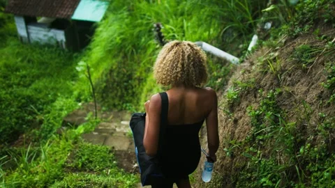 Light skin model walking down a hill in ... | Stock Video | Pond5