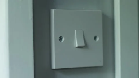 A light switch being turned by a man at ... | Stock Video | Pond5