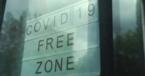 Lightbox with as sign covid 19 free zone... | Stock Video | Pond5