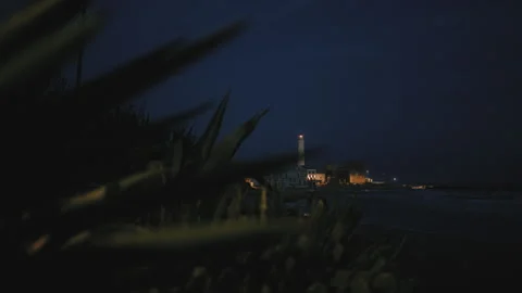 Lighthouse tower flashes at night | Stock Video | Pond5