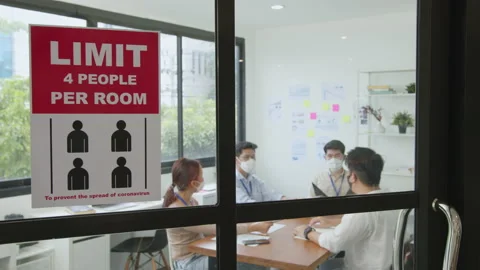 Limit people in meeting room sign over a... | Stock Video | Pond5