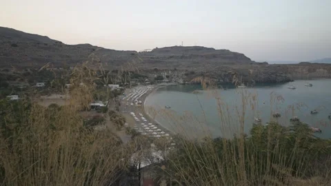 Lindos Beach at sunset in Lindos, Lindos... | Stock Video | Pond5
