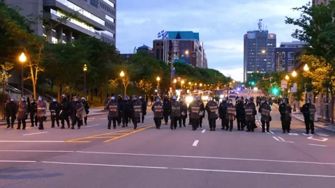 A line of Police in full riot shields an... | Stock Video | Pond5