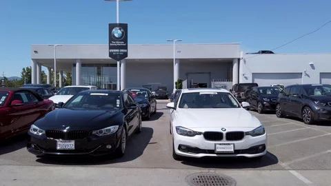 A lineup of brand new BMW cars at the de... | Stock Video | Pond5