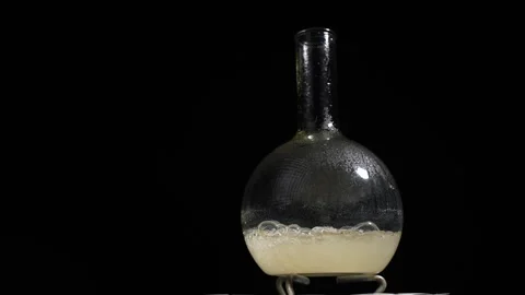 Liquid boils in a laboratory flask. Do d... | Stock Video | Pond5