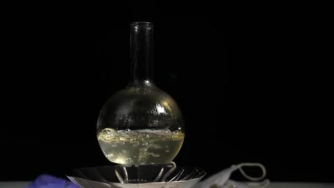 Liquid boils in a laboratory flask. Do d... | Stock Video | Pond5
