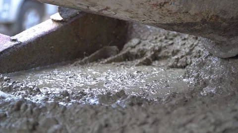 A liquid concrete mix poured into a form... | Stock Video | Pond5