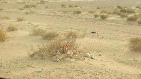 Littered dirty desert. Pollution of natu... | Stock Video | Pond5