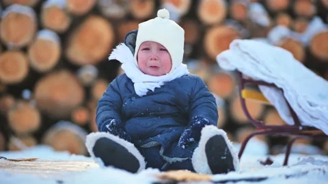 A little baby is crying sitting in the s... | Stock Video | Pond5