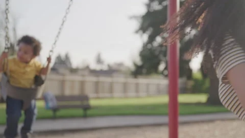 Little Boy Being Pushed on a Swing | Stock Video | Pond5