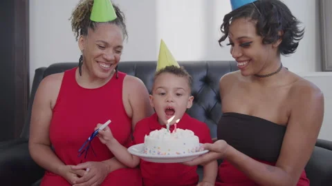 Little Boy Blows Out Birthday Candles wi... | Stock Video | Pond5