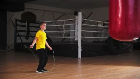 A little boy jumping over the rope near ... | Stock Video | Pond5